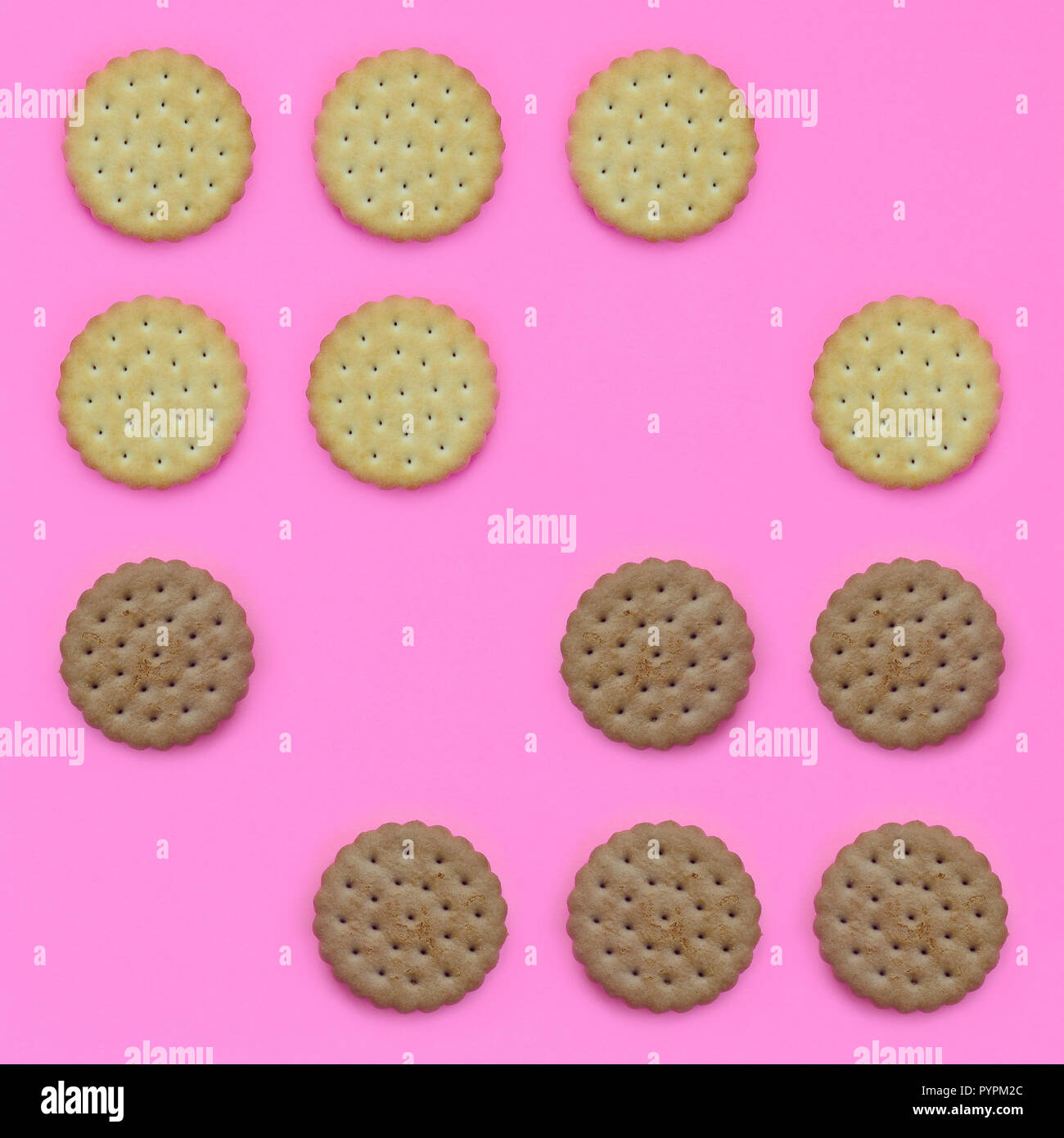 Pattern of a brown biscuits on a pink background. Trendy minimal ...