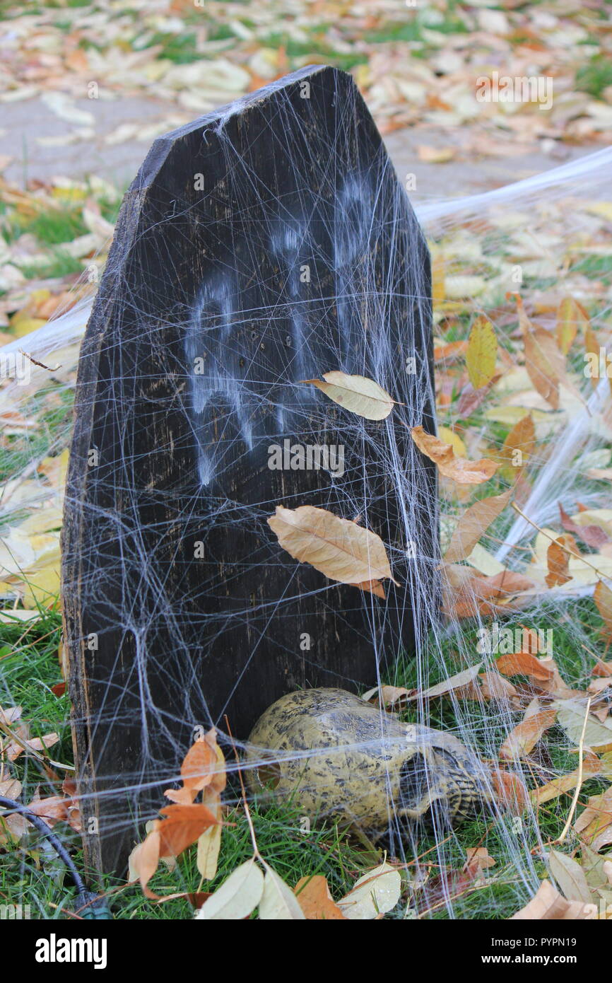 RIP tombstone epitaph with a human skull on the ground as Creative ...