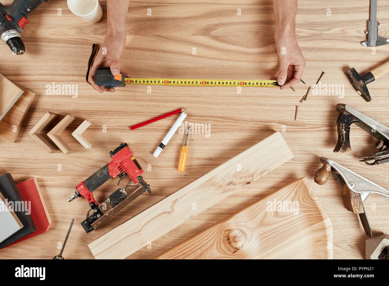 Set of carpenter's tools on wooden background Stock Photo - Alamy