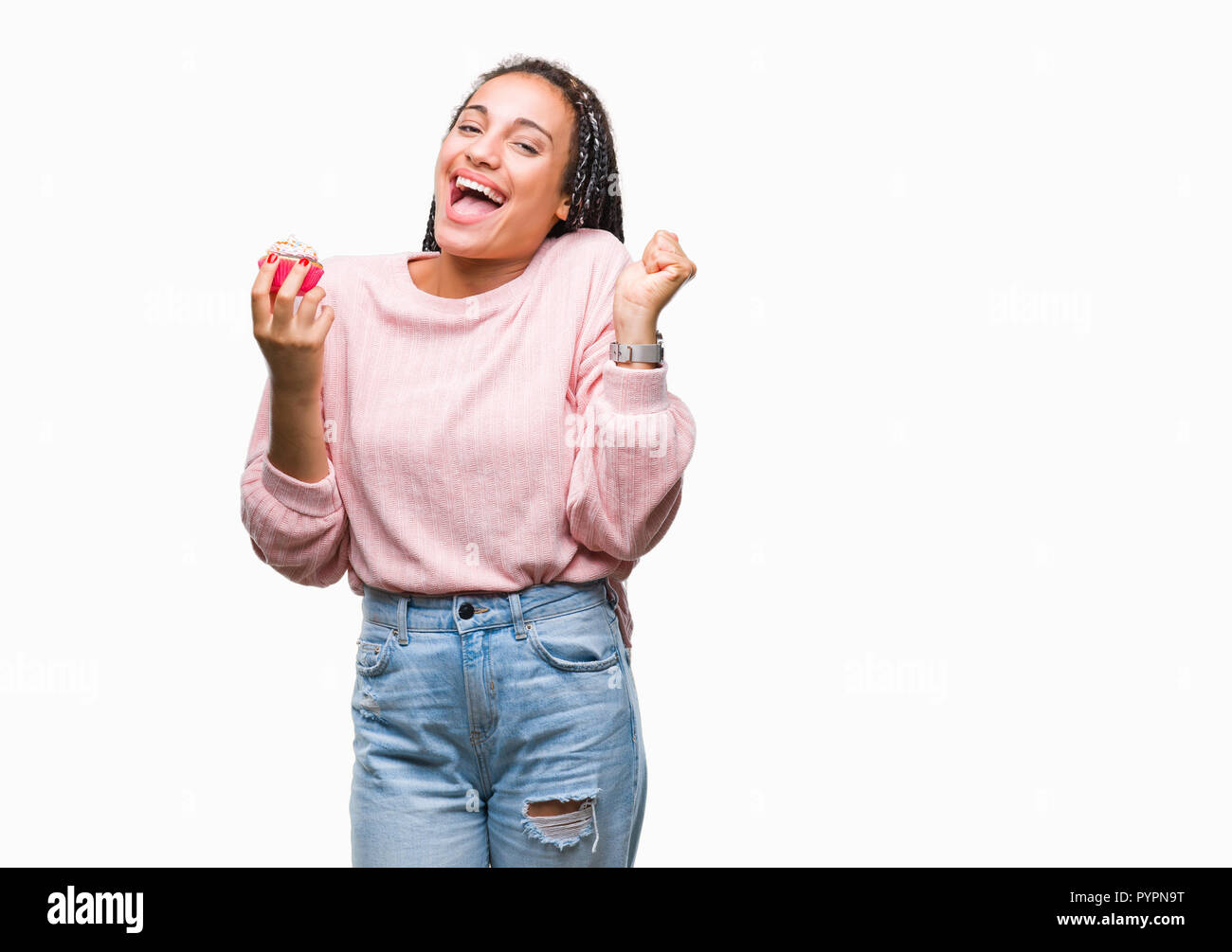 Young african american girl eating cupcake over isolated background ...