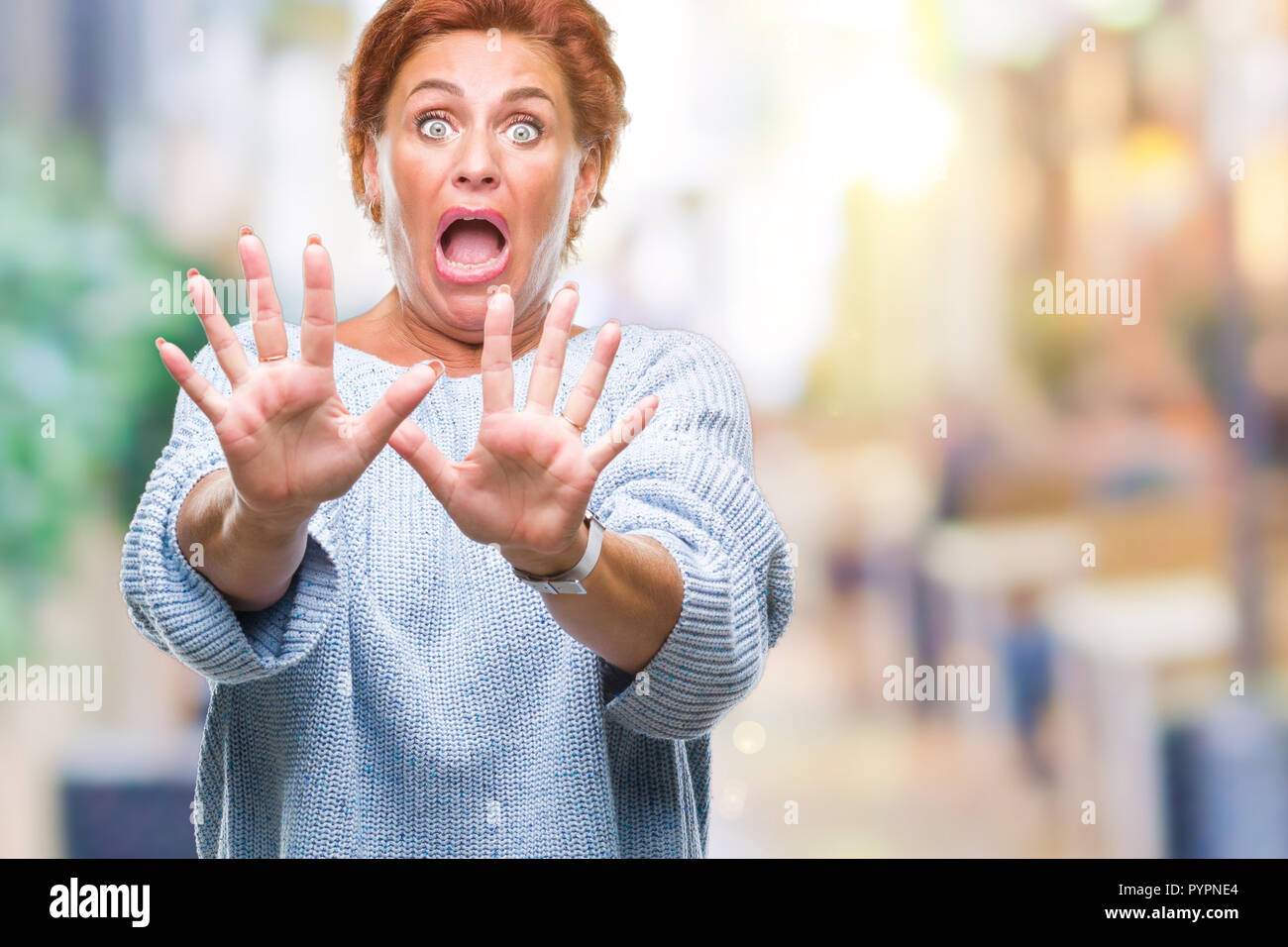 Attractive mature woman shocked horrified hi-res stock photography and ...