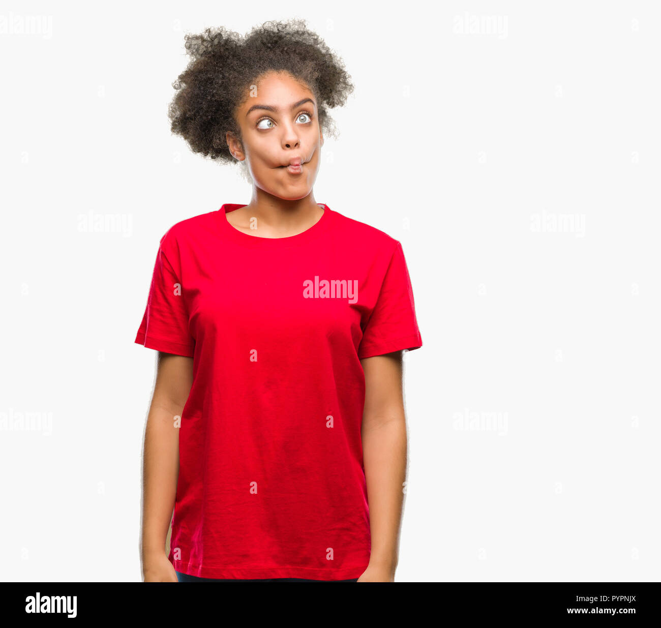 Young afro american woman over isolated background making fish face ...