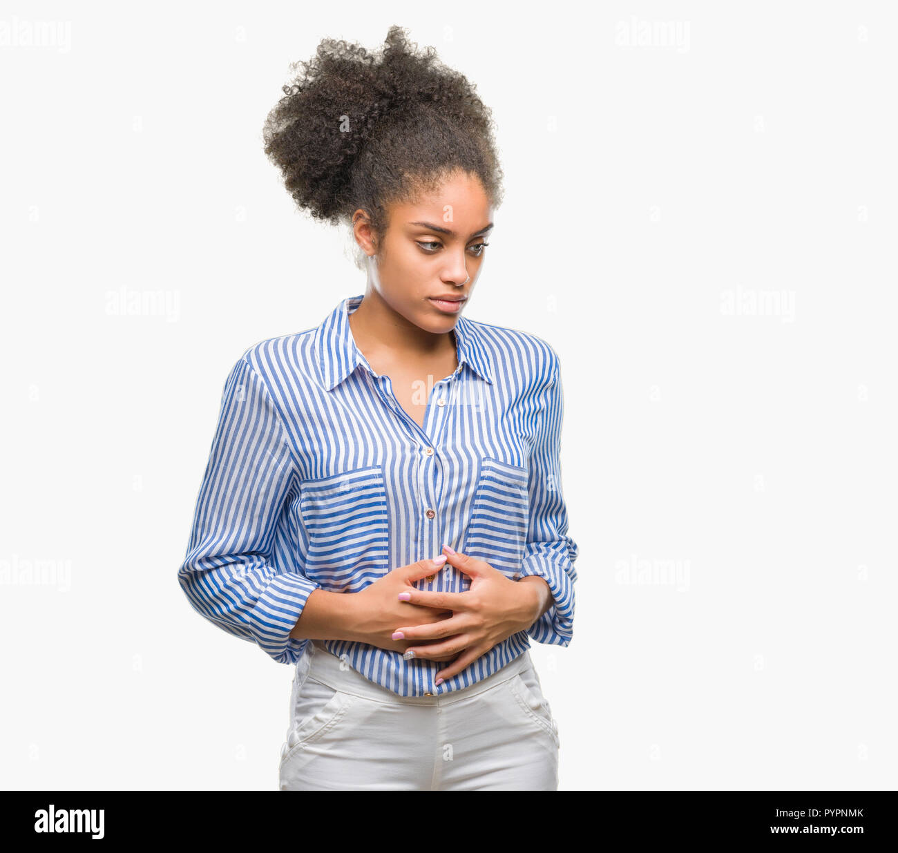 Young afro american woman over isolated background with hand on stomach ...