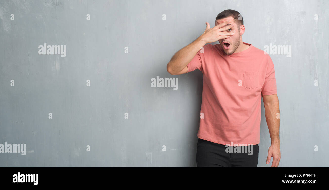 Man peeking over wall hi-res stock photography and images - Alamy