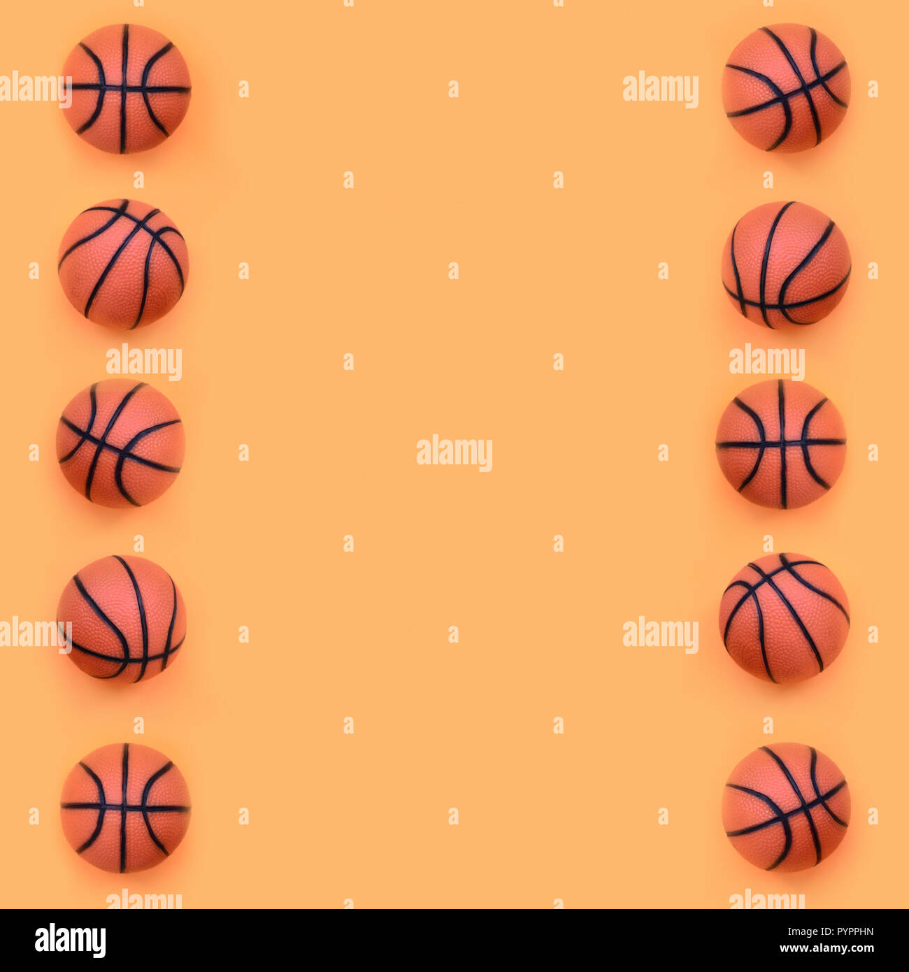Many small orange balls for basketball sport game lies on texture ...