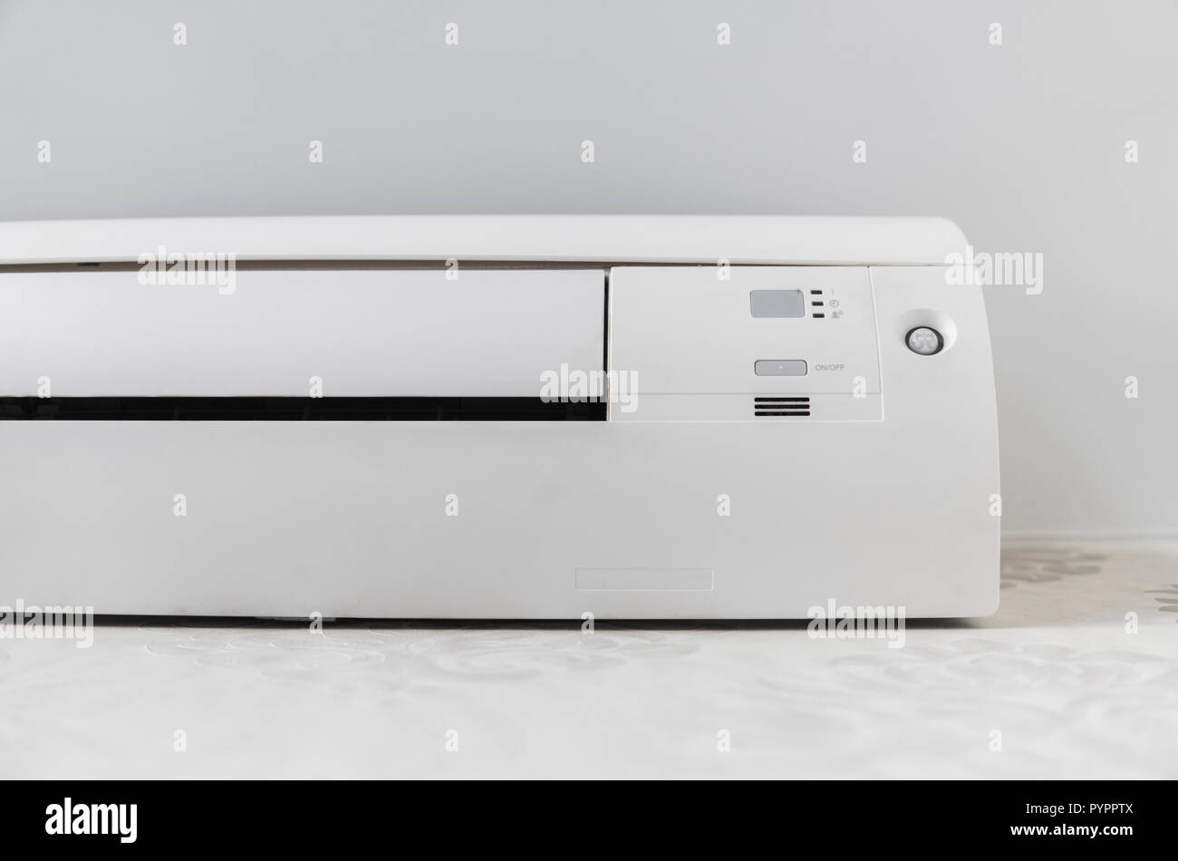 White air conditioner system on white wall in a room Stock Photo - Alamy