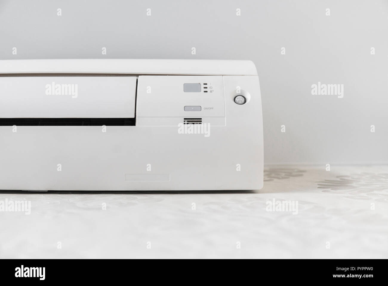 White air conditioner system on white wall in a room Stock Photo - Alamy