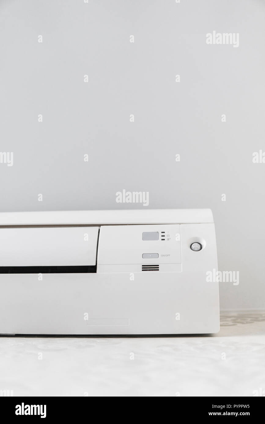 White air conditioner system on white wall in a room Stock Photo - Alamy