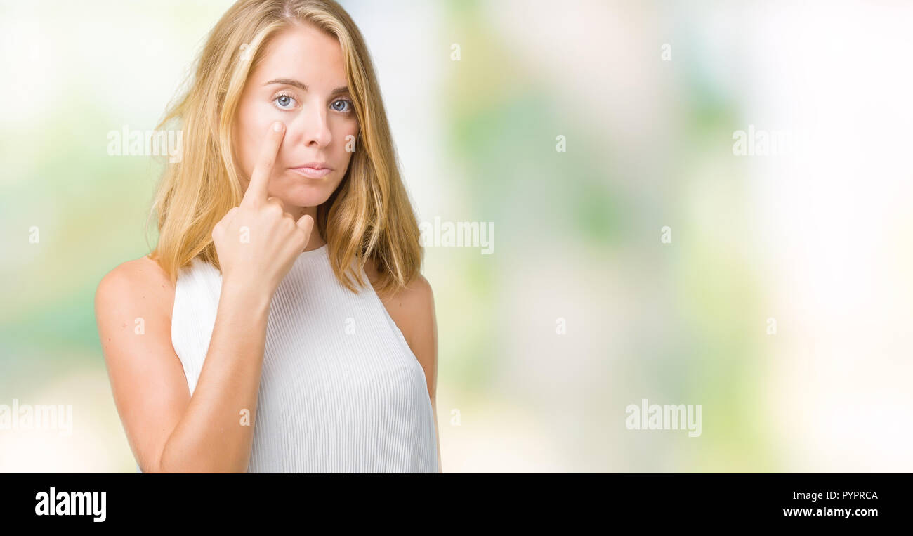 Beautiful young elegant woman over isolated background Pointing to the ...