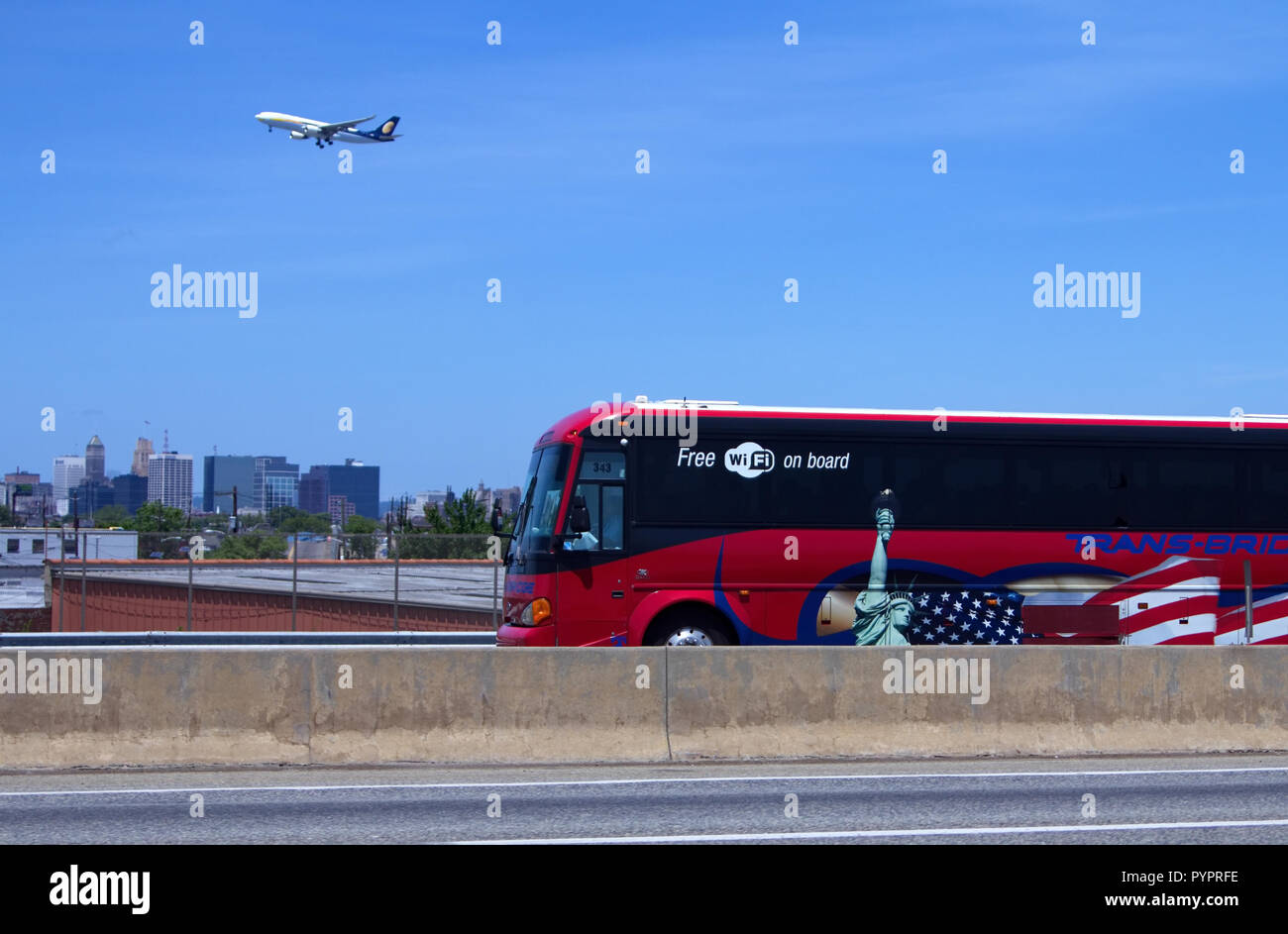 Elizabeth, NJ USA. June 2013. A modern traveling tour bus and a flying ...