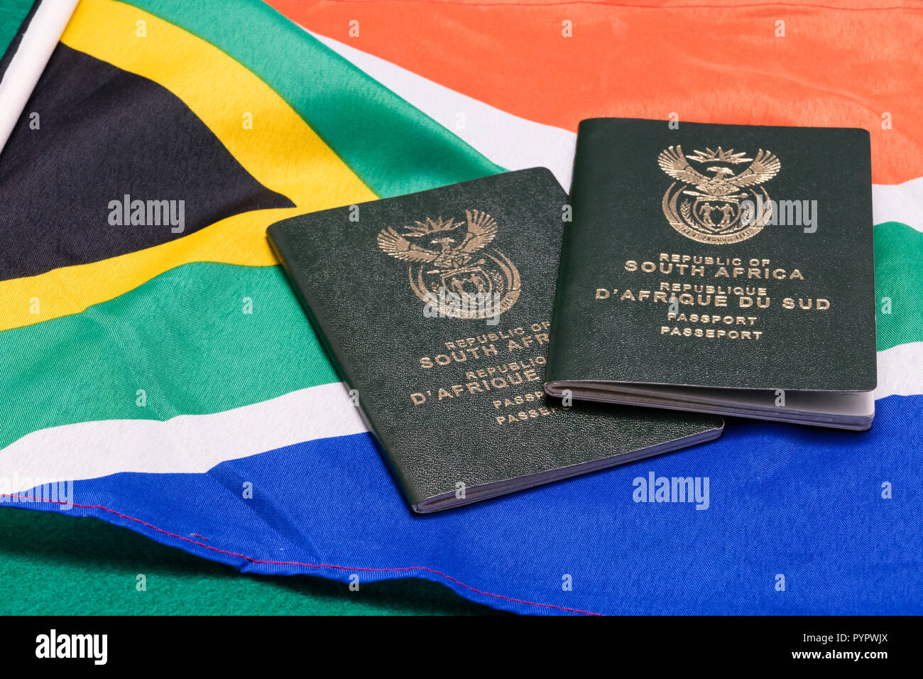 South African passports on SA flag Stock Photo - Alamy