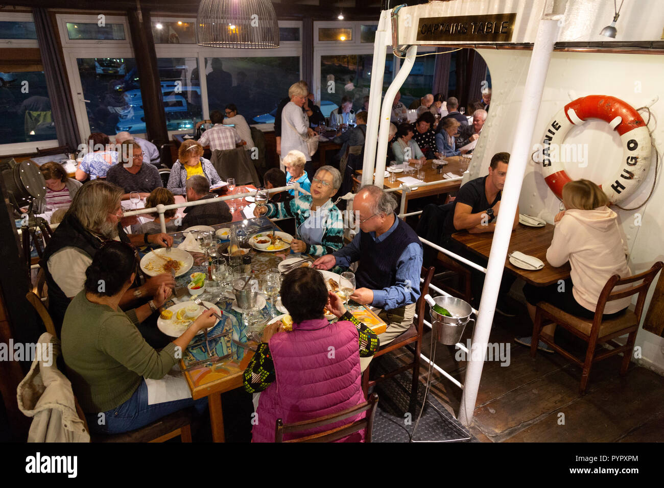 Namibia Restaurant - people eating in The Tug restaurant, Swakopmund ...