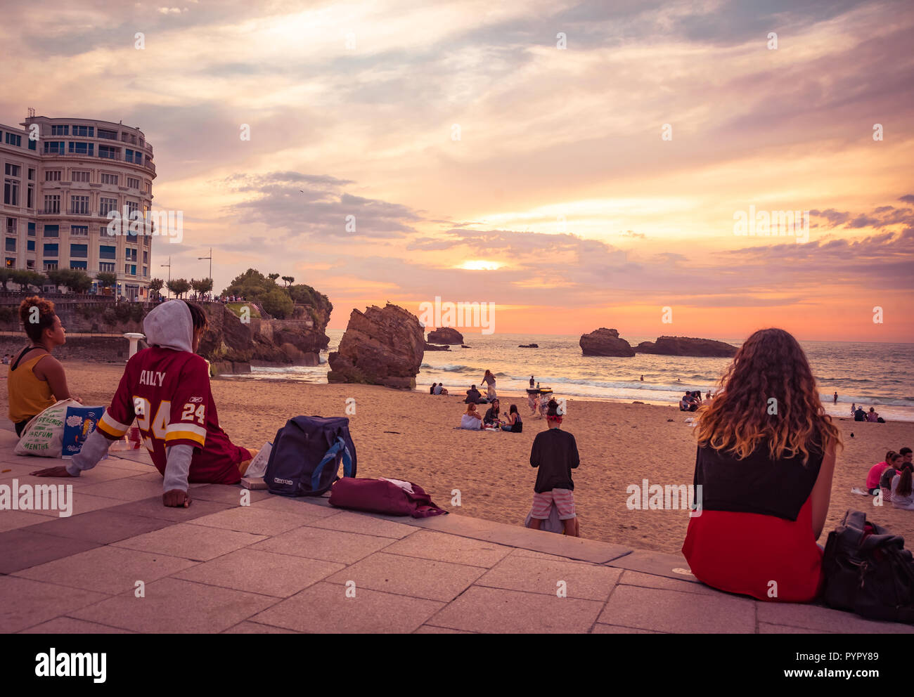 july 07 2018 Biarritz , France . People enjoying a summer sunset on the ...