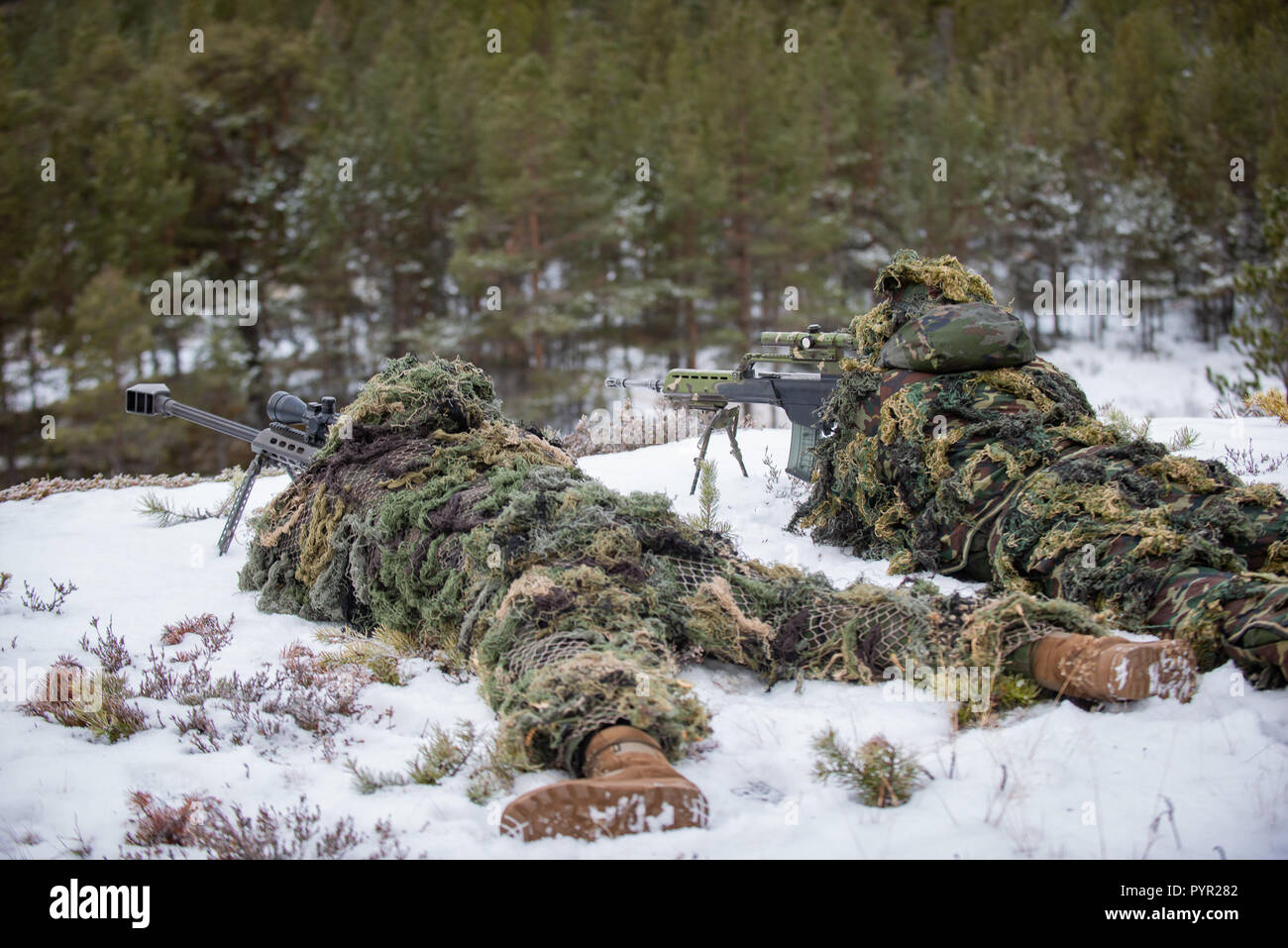 A sniper and his spotter of the Spanish Lepanto Battalion line up their ...