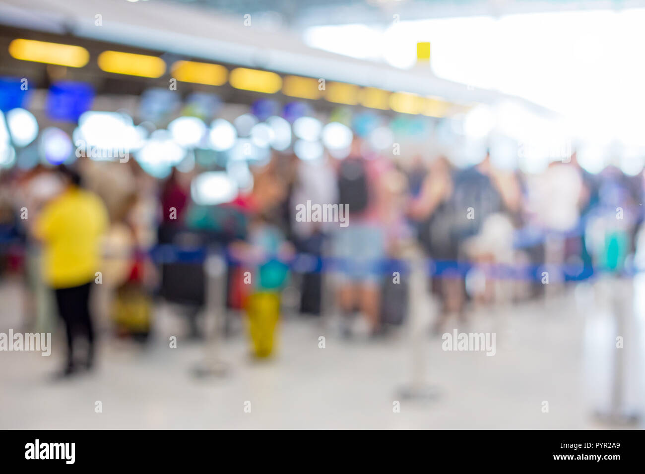 Blurred photo of people getting in line at the airline check in ticket ...