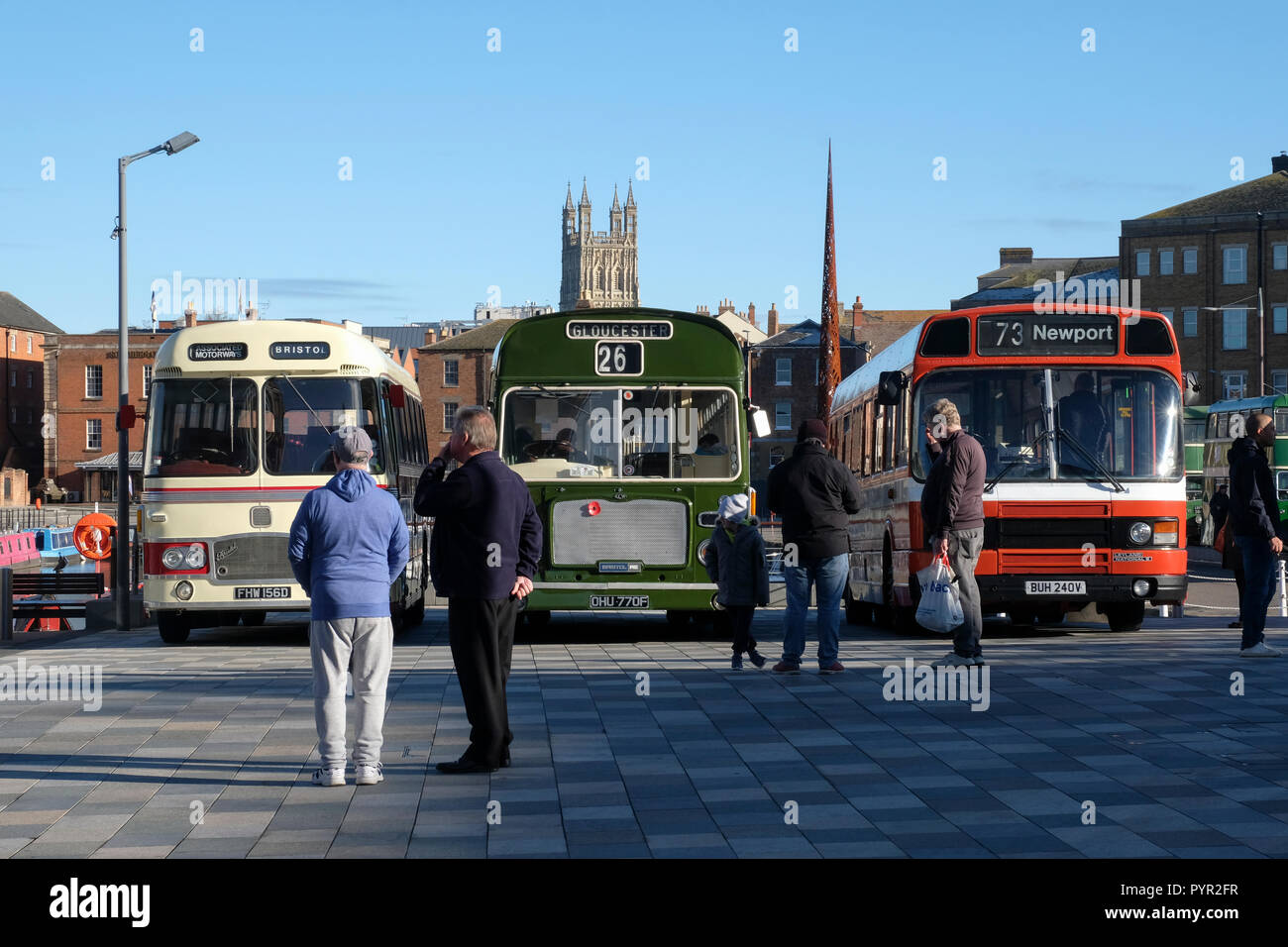 Classic buses with Gloucester Cathedral in the background Stock Photo ...