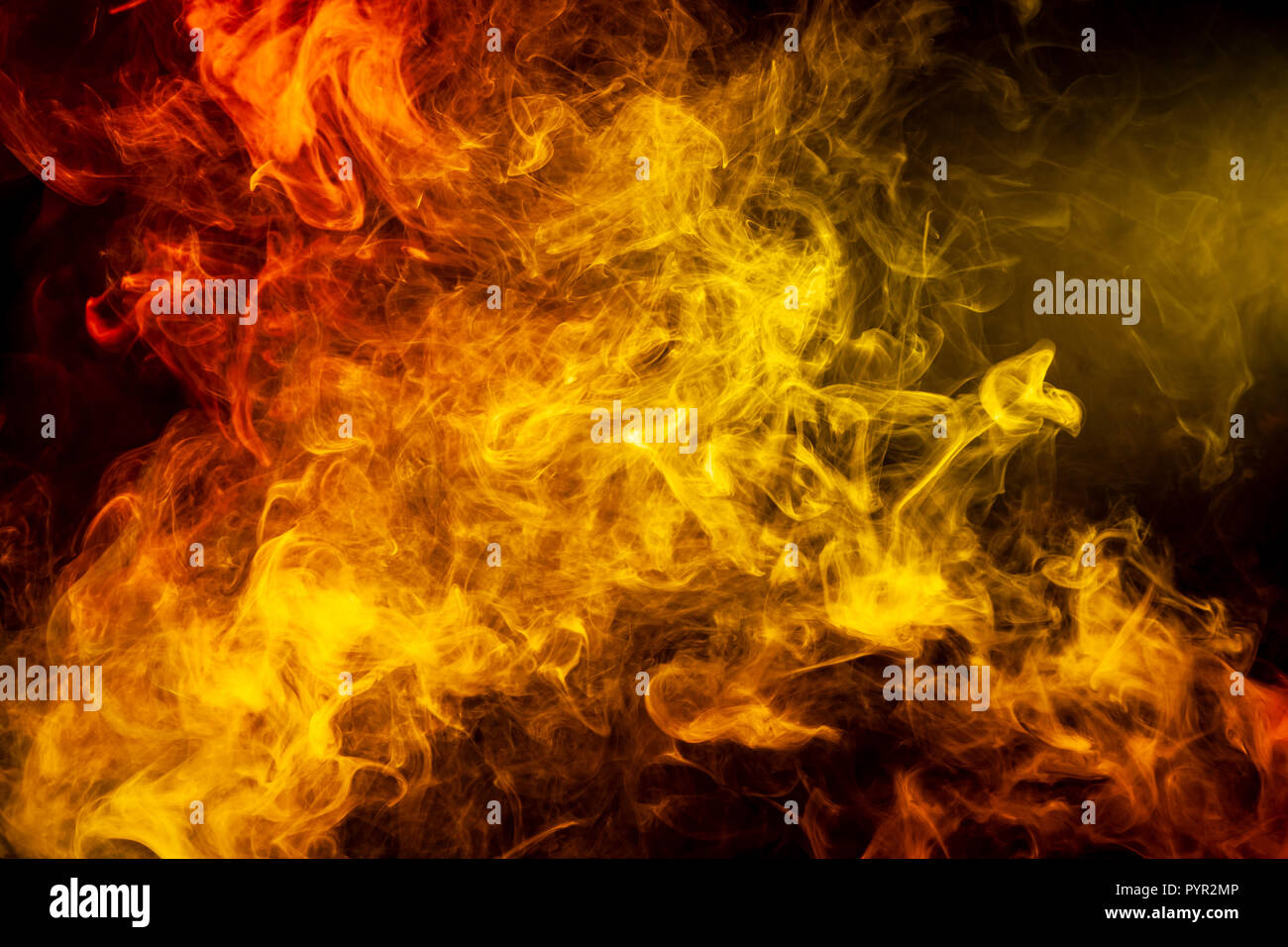 Fire flames background. Colorful fiery smoke on a black isolated ...