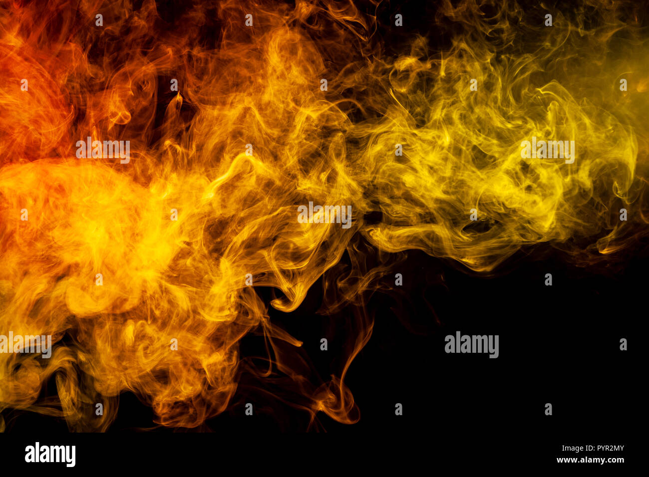 Fire flames background. Colorful fiery smoke on a black isolated ...