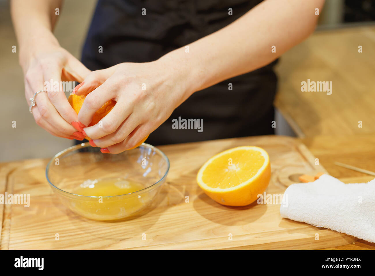 African hand squeezing orange hi-res stock photography and images - Alamy