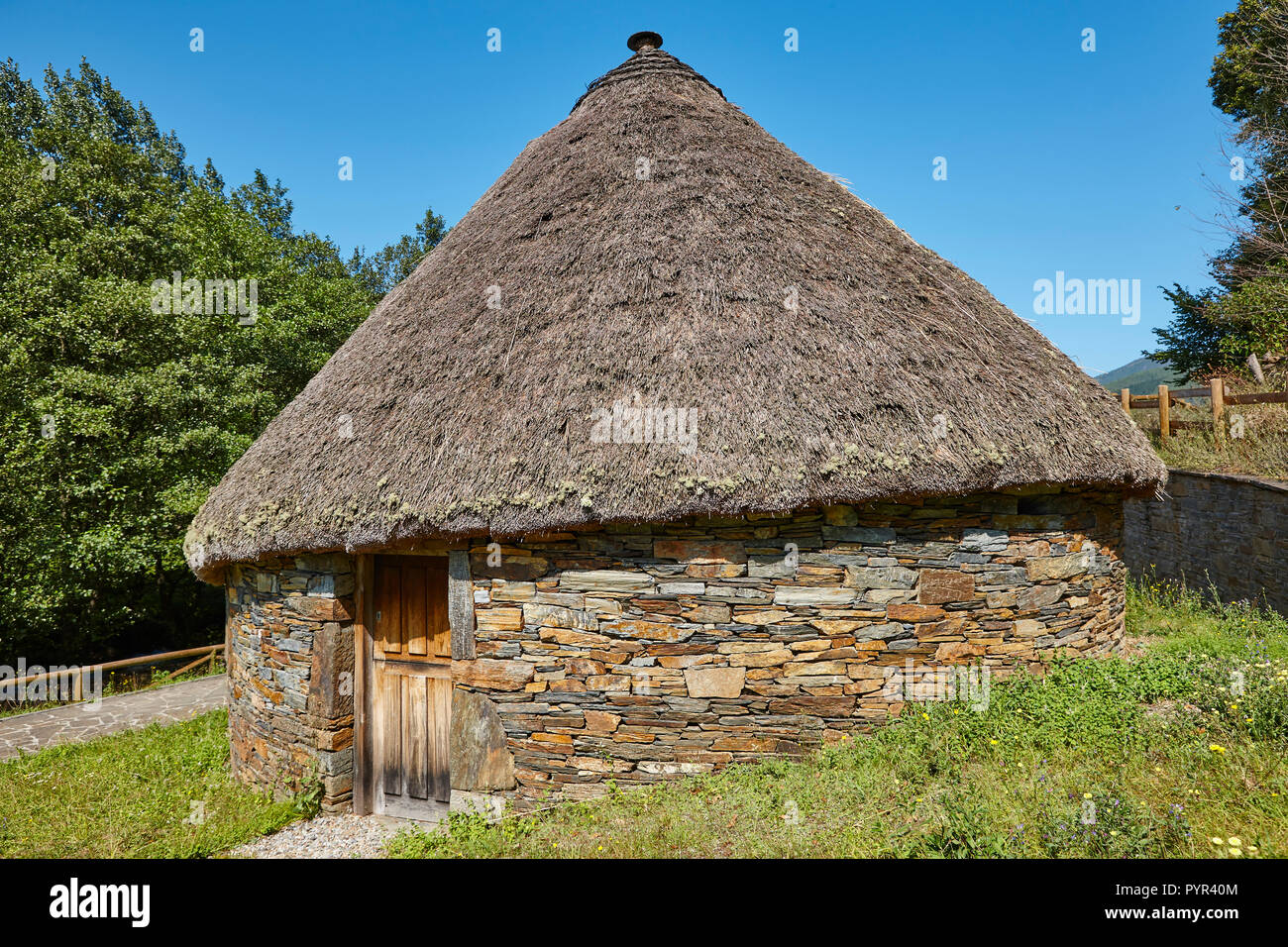Traditional spanish construction made with stones and conical roof ...
