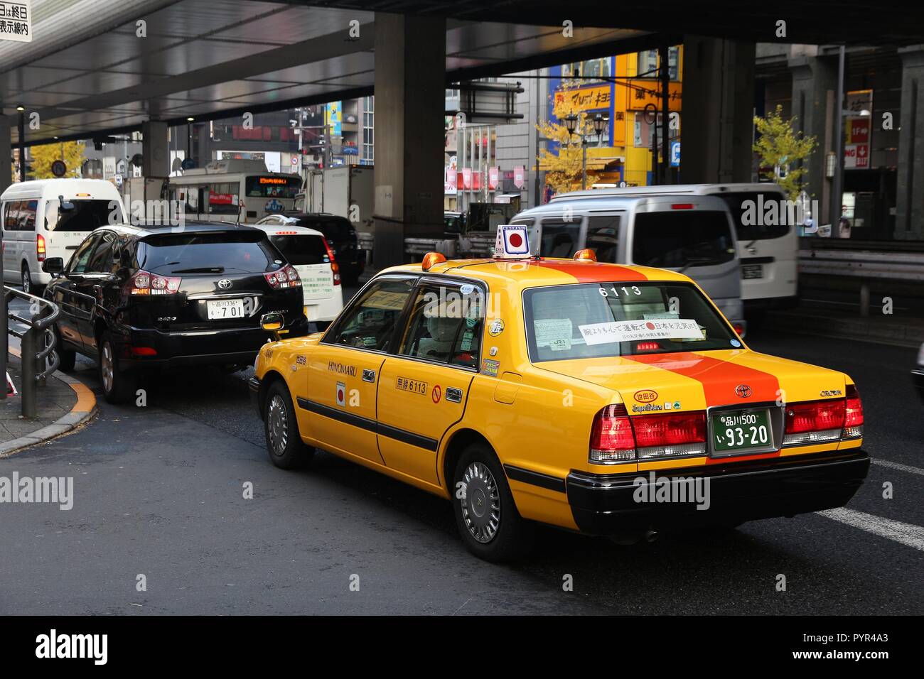 TOKYO, JAPAN - DECEMBER 1, 2016: Taxi cab drives in Roppongi district ...