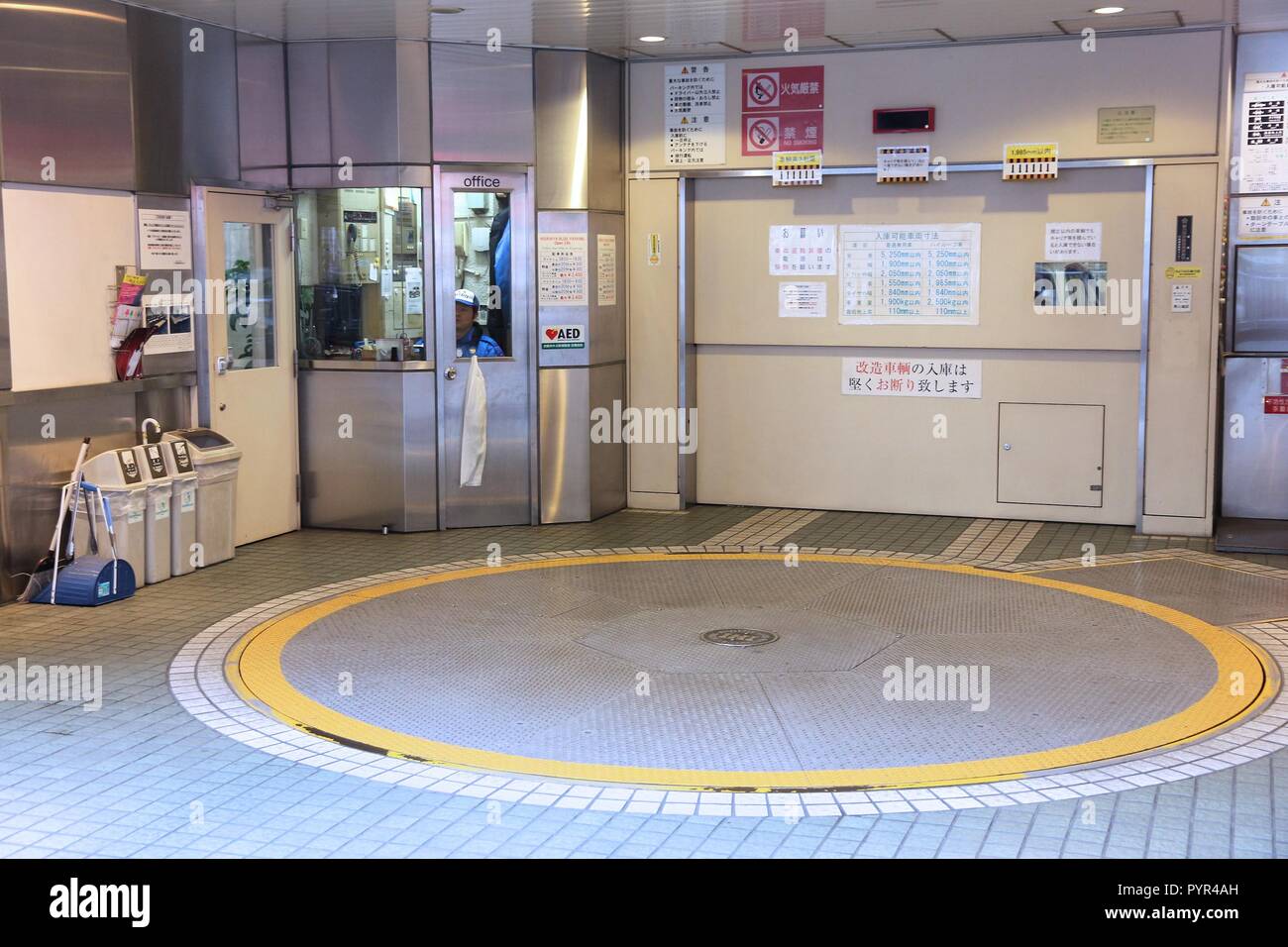 TOKYO, JAPAN - DECEMBER 1, 2016: Automatic vertical car parking garage ...