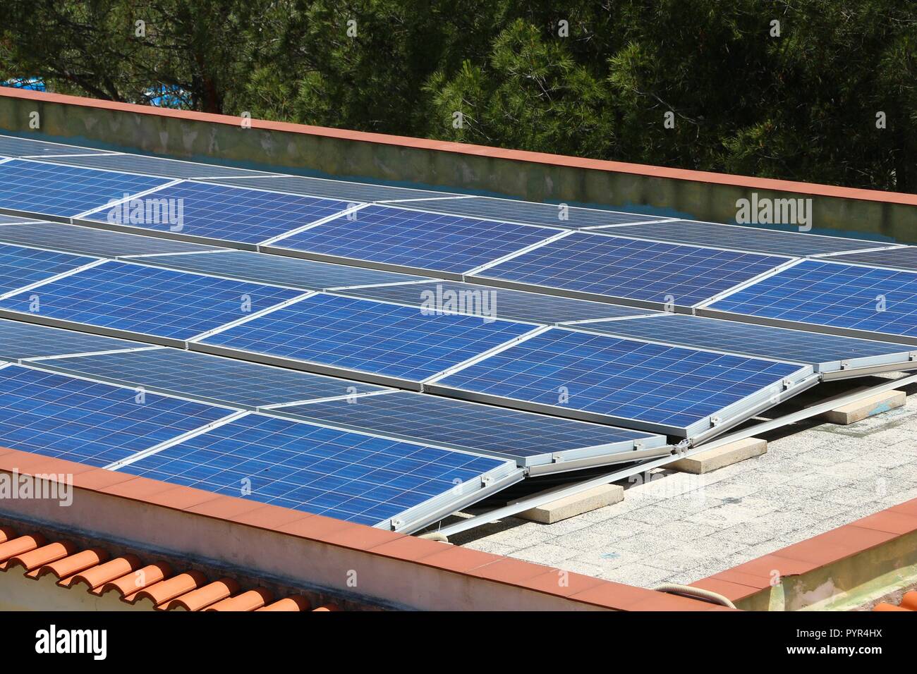Rooftop solar panels - photovoltaic electricity cells installation in ...
