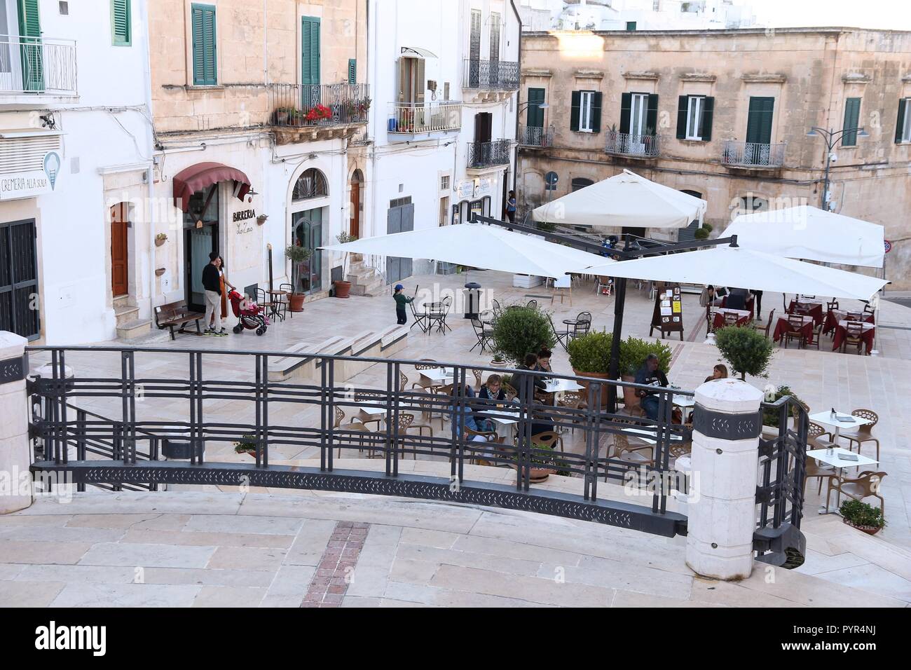 OSTUNI, ITALY - MAY 29, 2017: People visit Ostuni Old Town in Italy ...