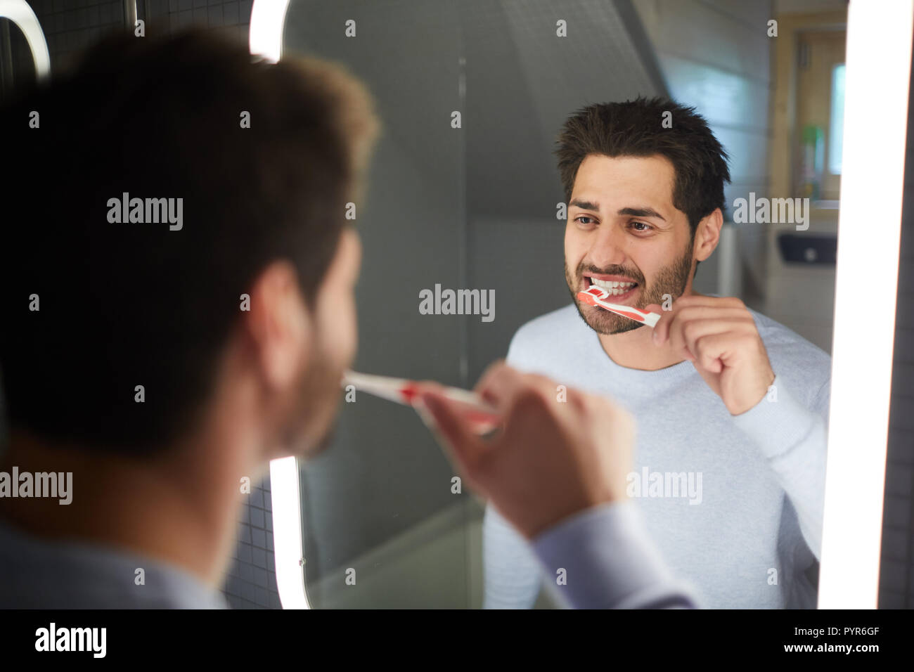 Young man brushing teeth tooth hi-res stock photography and images - Alamy