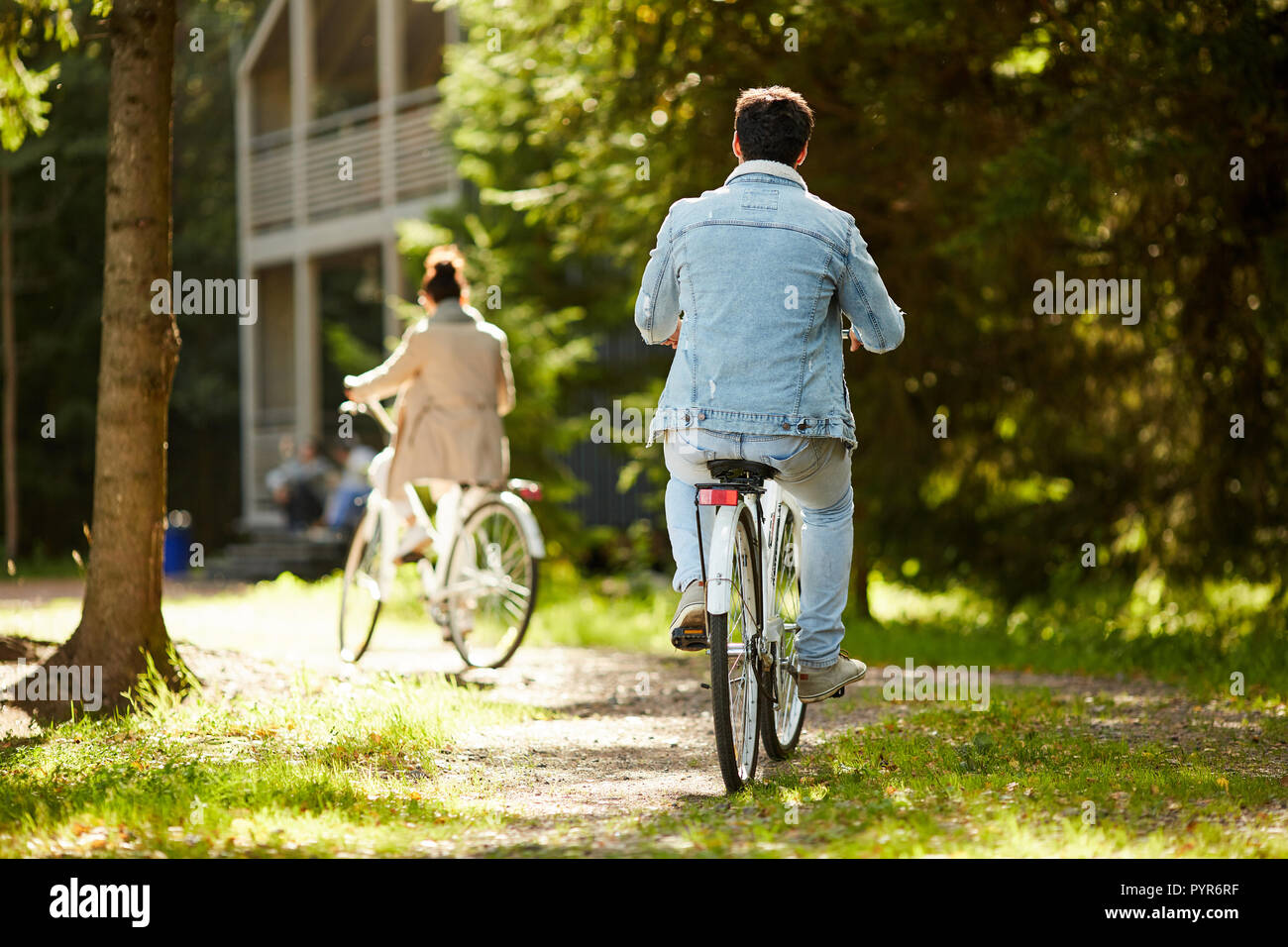 Young couple racing each other home Stock Photo - Alamy