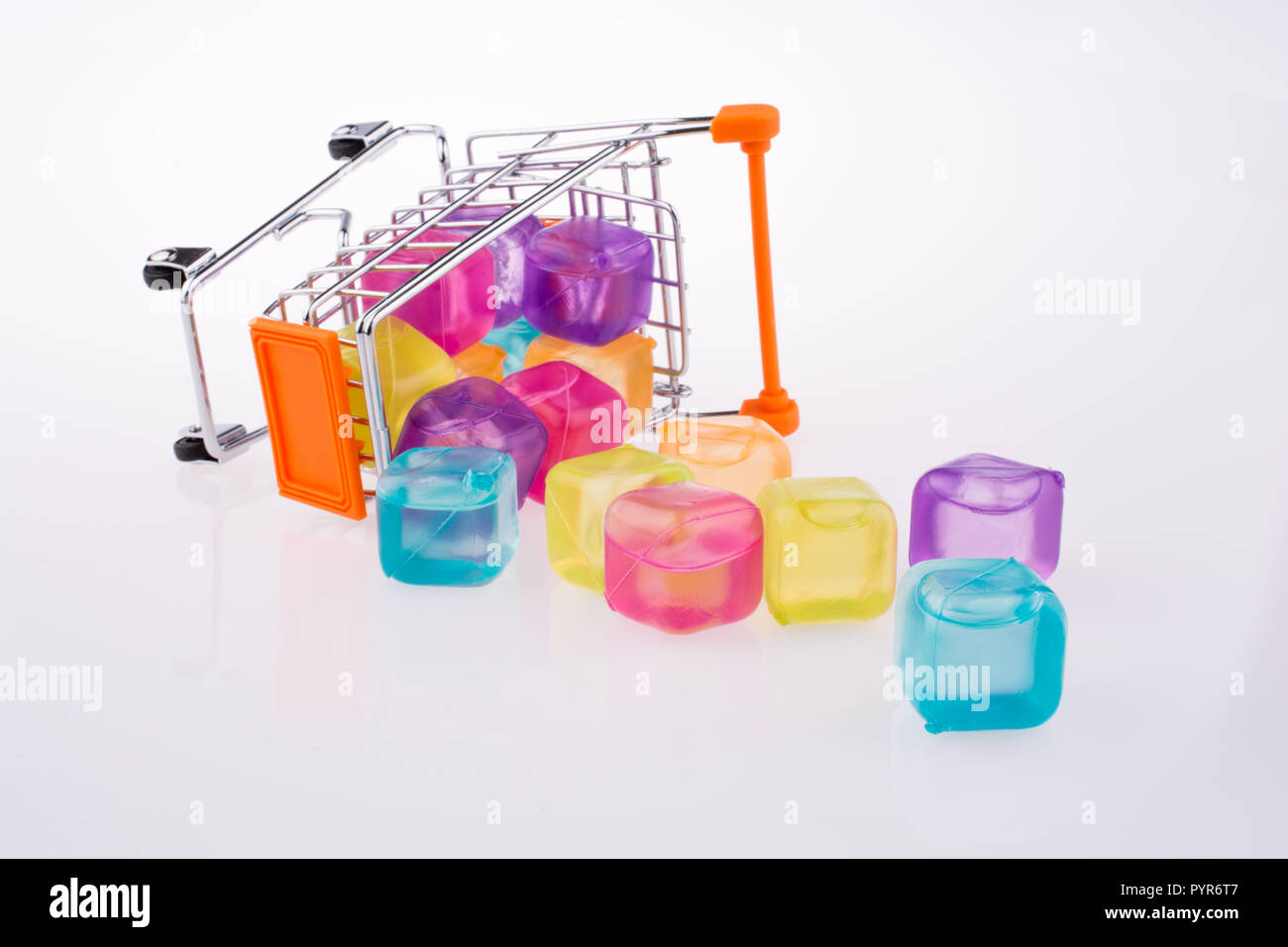 Colorful blocks come out of a tumbled shopping cart Stock Photo - Alamy