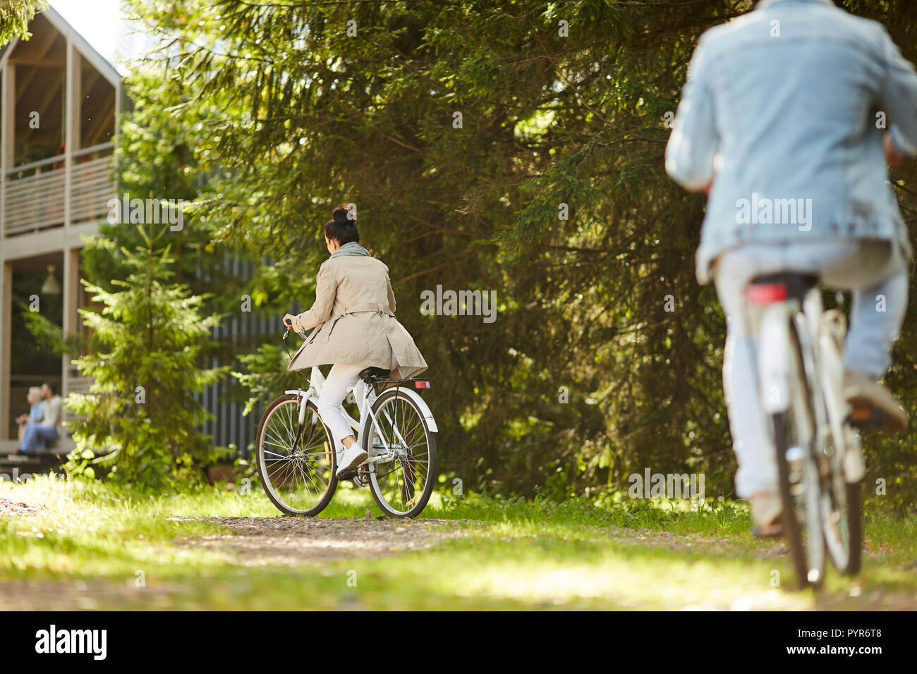 Riding bikes to countryside house Stock Photo - Alamy