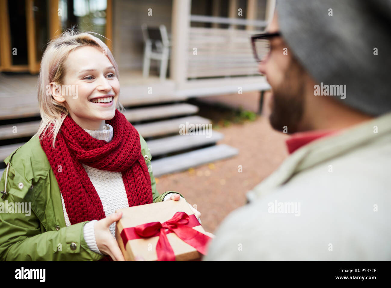 Girl Getting Gift From Boyfriend Stock Photo - Alamy