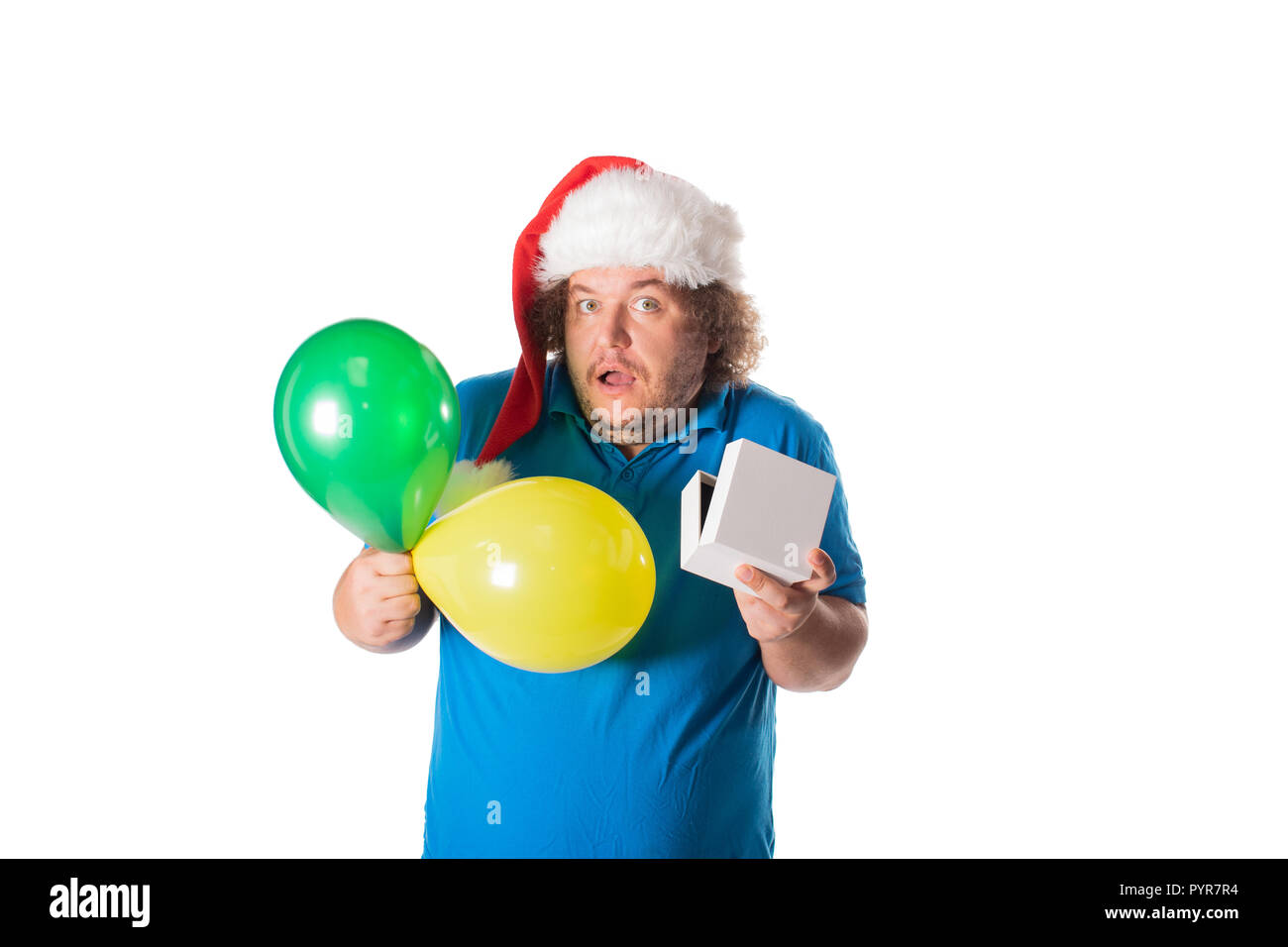 Funny fat man in Santa hat with balloons and gifts. Christmas and ...