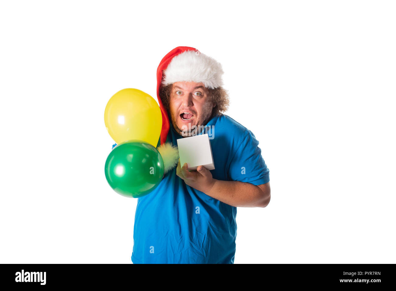Funny fat man in Santa hat with balloons and gifts. Christmas and ...