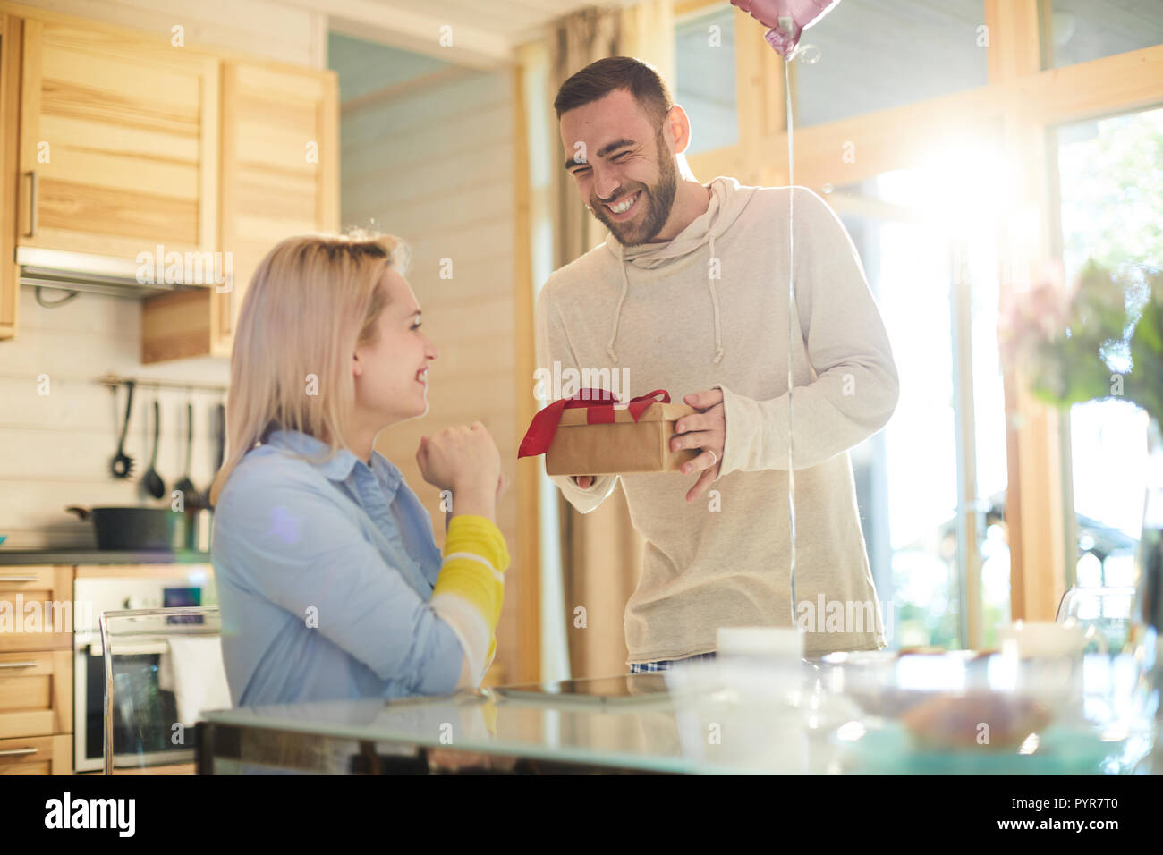 Woman Getting Present From Beloved Stock Photo - Alamy