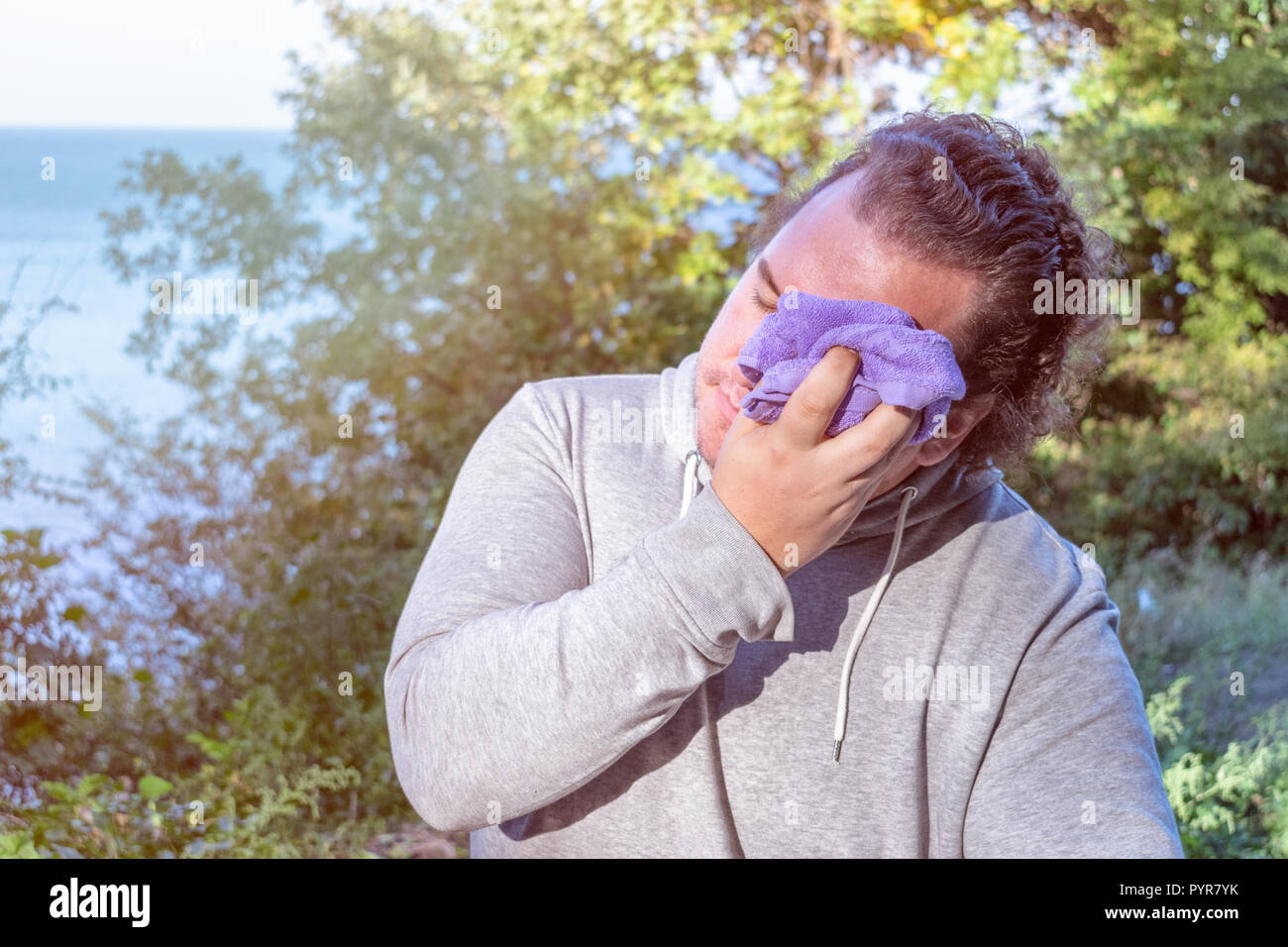 Fat man wipes face hi-res stock photography and images - Alamy