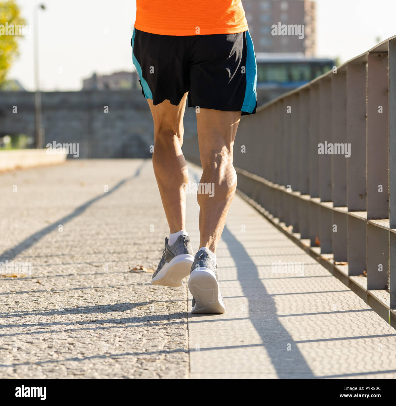 Close up image of strong athletic legs with ripped calf muscle of sport ...
