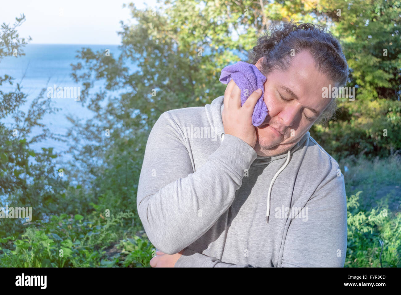 Fat man wipes face hi-res stock photography and images - Alamy