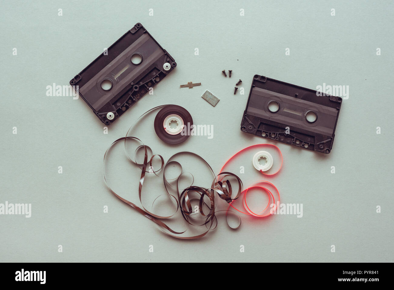 Flat lay audio cassette parts on pastel blue background, top view of ...