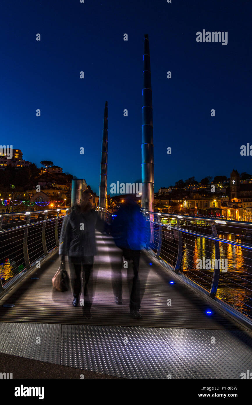Two people showing motion blur crossing a marina bridge at night Stock ...