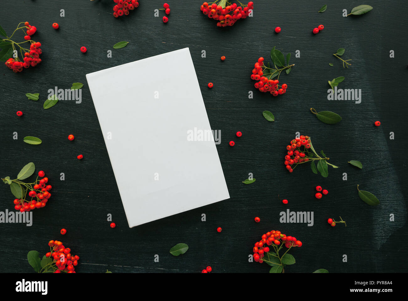 Hardcover book cover design mock up top view overhead shot with floral ...