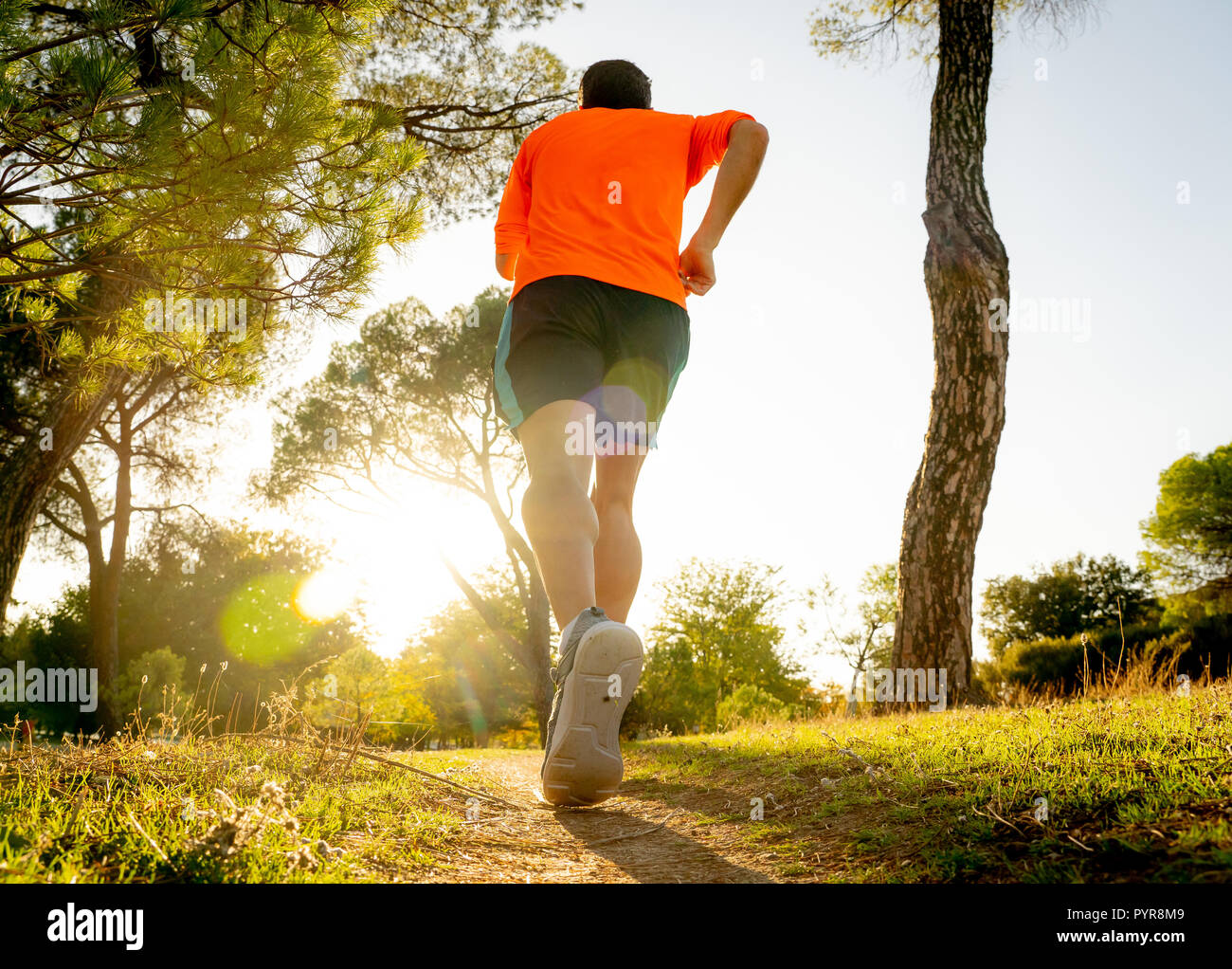 Back view of young dynamic athlete runner man with fit strong body ...