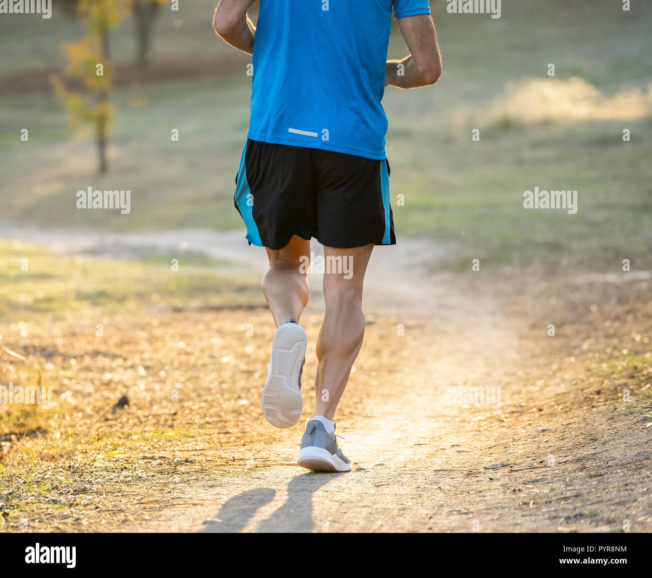 Back view of young dynamic athlete runner man with fit strong body ...