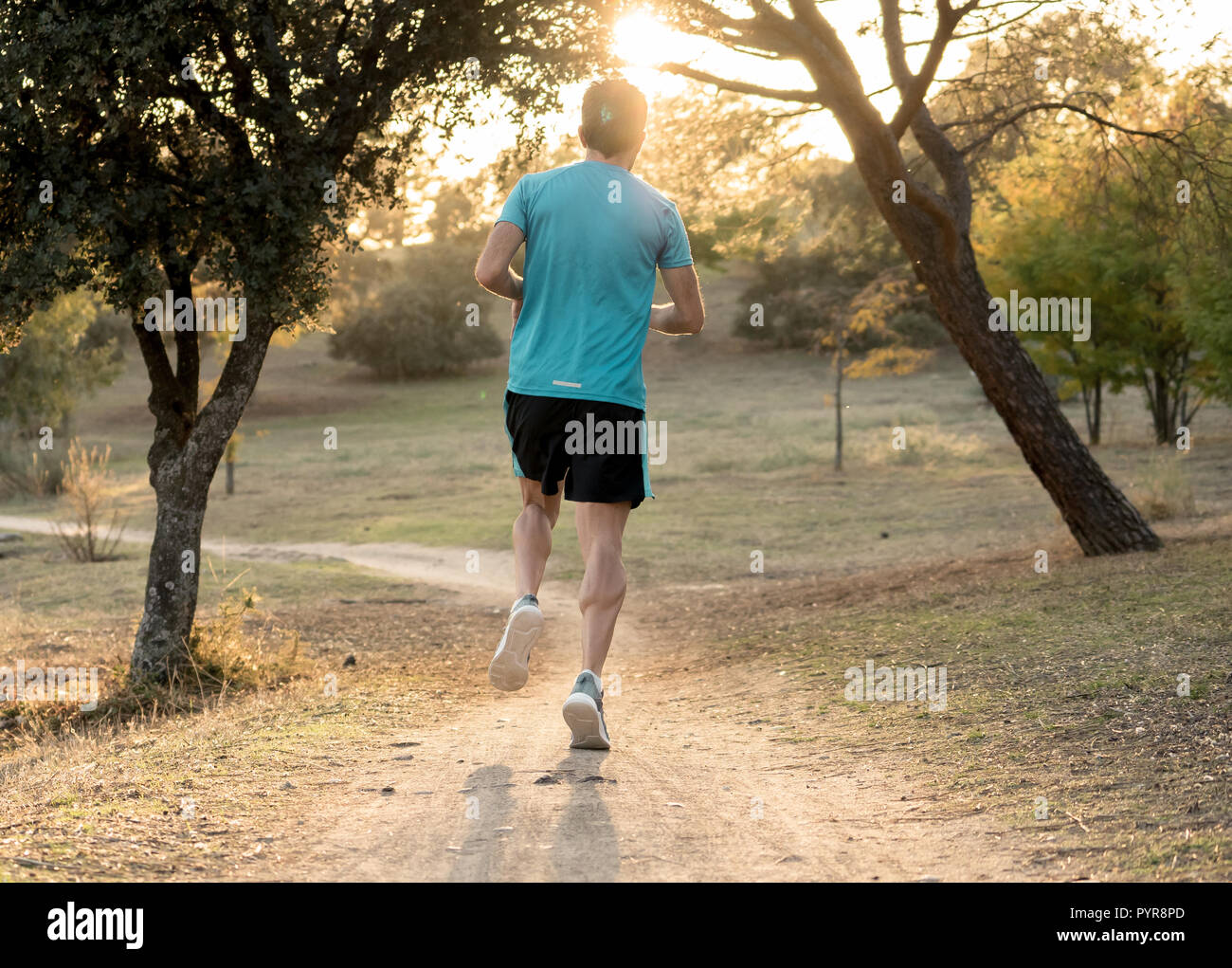Back view of young dynamic athlete runner man with fit strong body ...