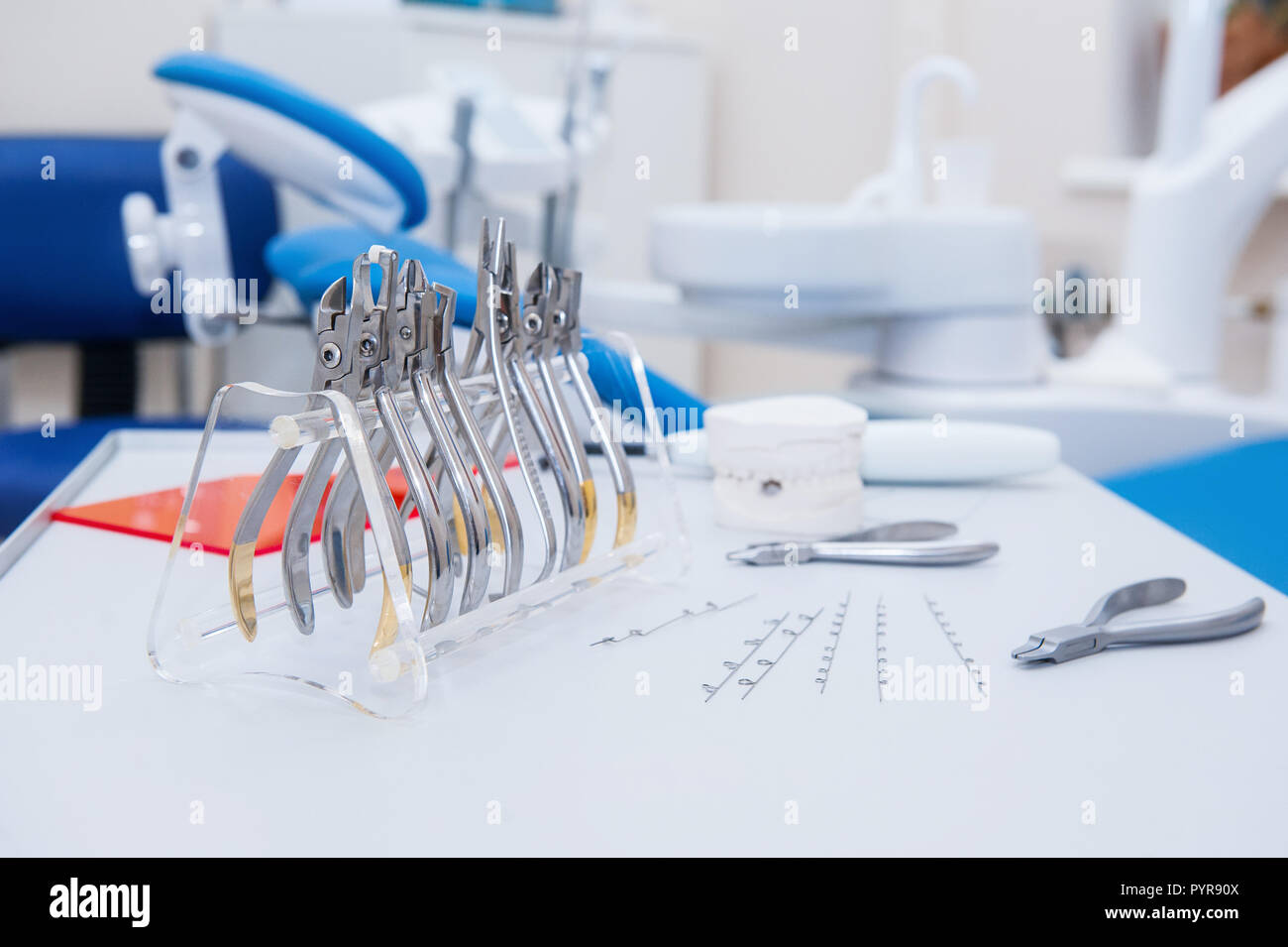 Close up Orthodontist Dental set of clamps and pliers and other tools ...