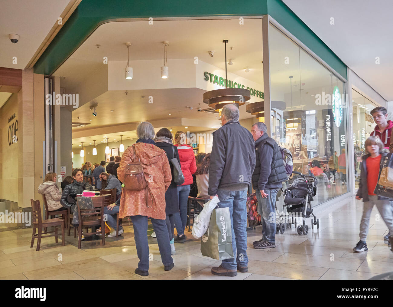 Queue at Starbucks coffee shop, Arcade shopping centre, Cambridge ...