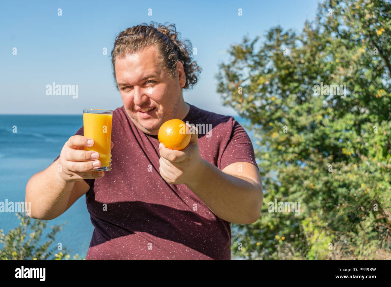 Fat people eating fruits hi-res stock photography and images - Alamy