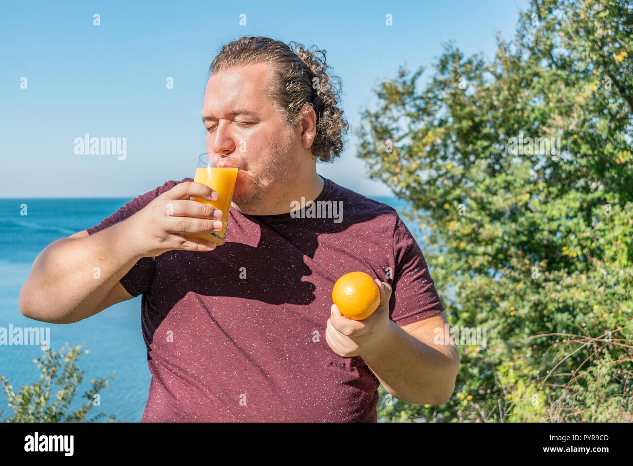 Fat people eating fruits hi-res stock photography and images - Alamy