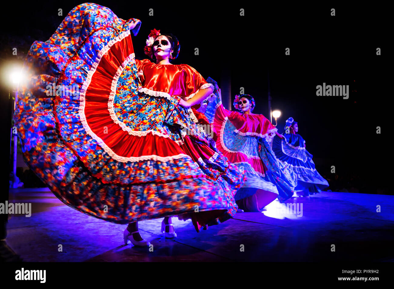 Dancing Catrinas with skull make up for dias de los muertos with ...